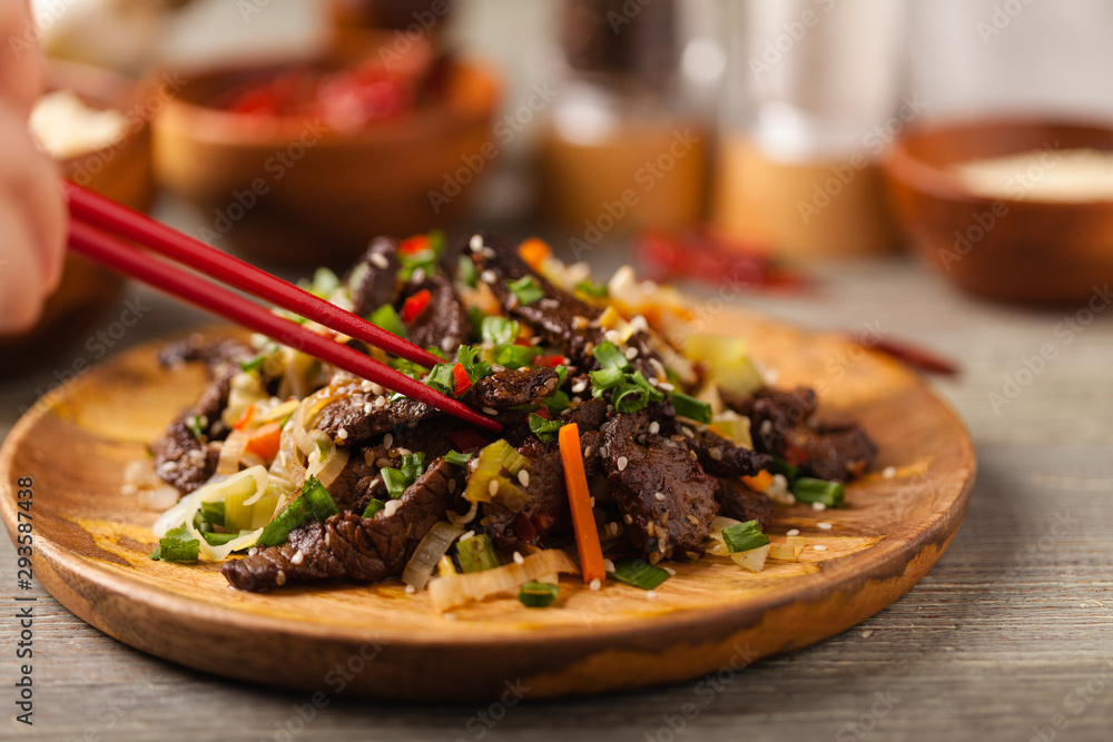 Traditional Korean Bulgogi dish. Thinly cut, grilled beef, served with ...