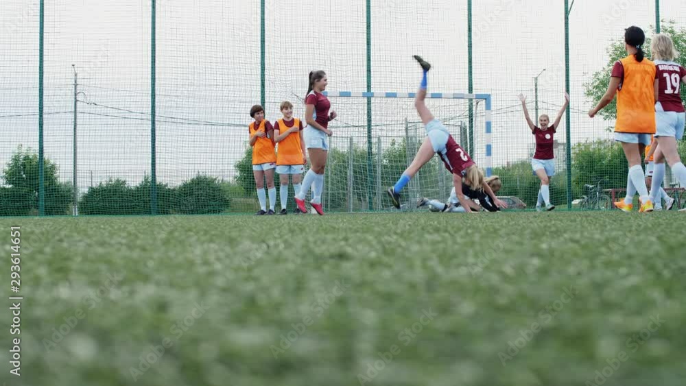 Female soccer player shooting goal, celebrating it, handspringing and ...