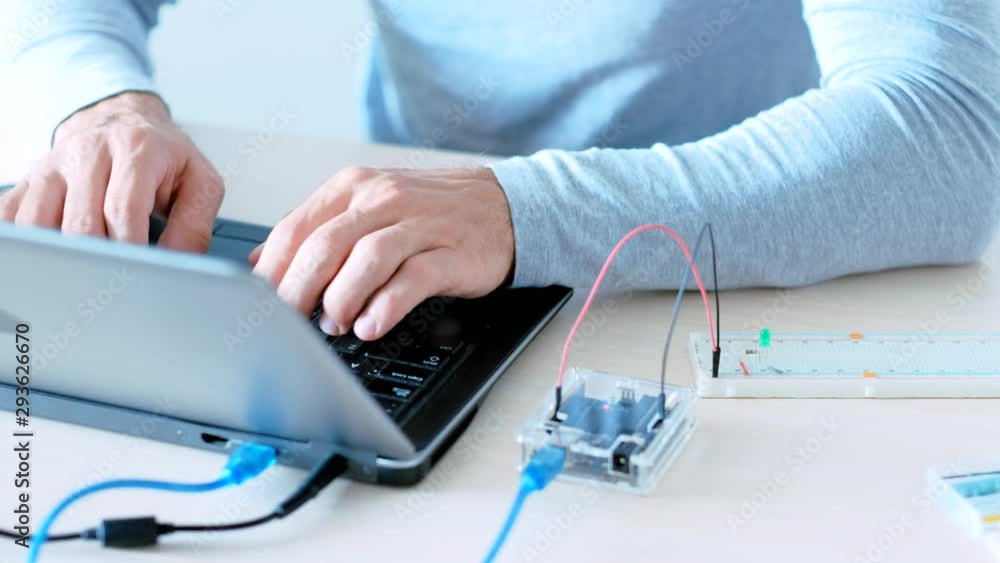 Mechatronic engineering. Internet of Things. IT programmer creating ...