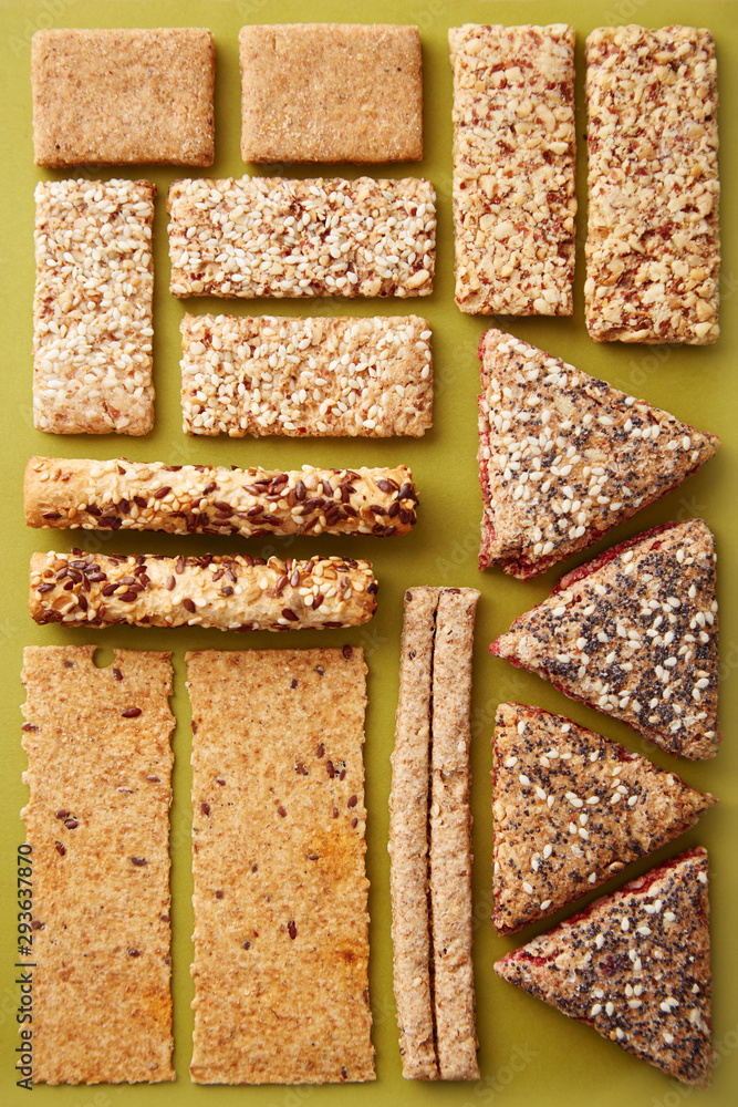 Assorted whole grain pastry snacks with seeds viewed from above. Flat ...