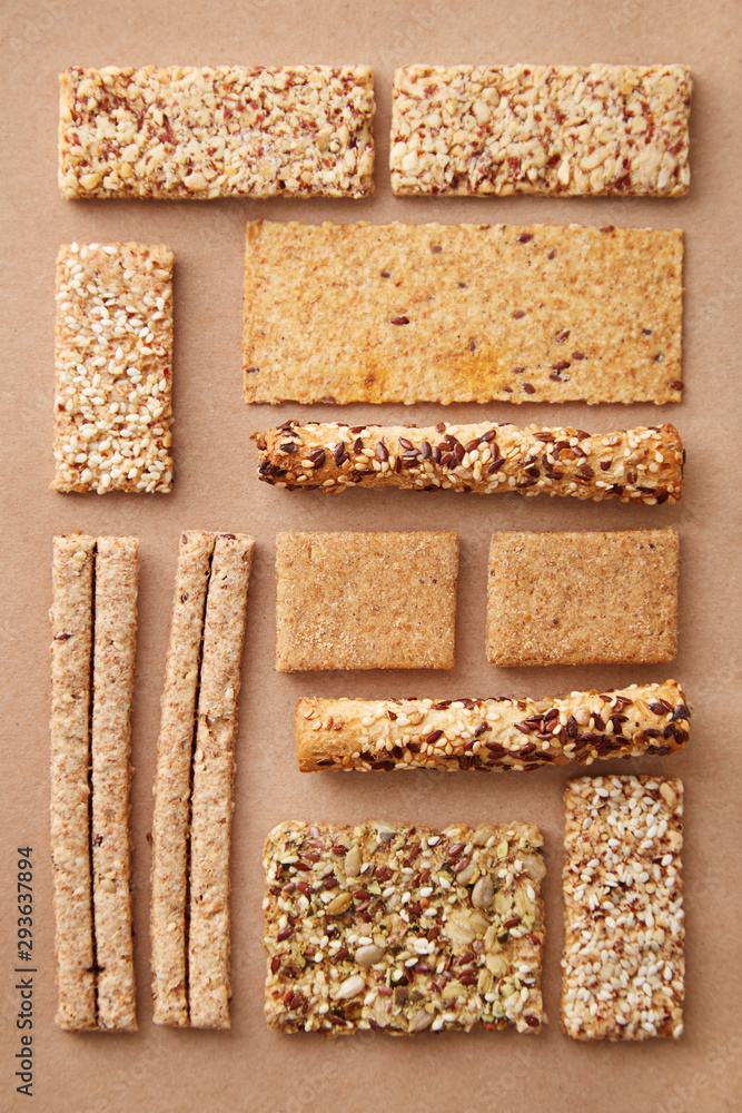 Assorted whole grain pastry snacks with seeds viewed from above. Flat ...