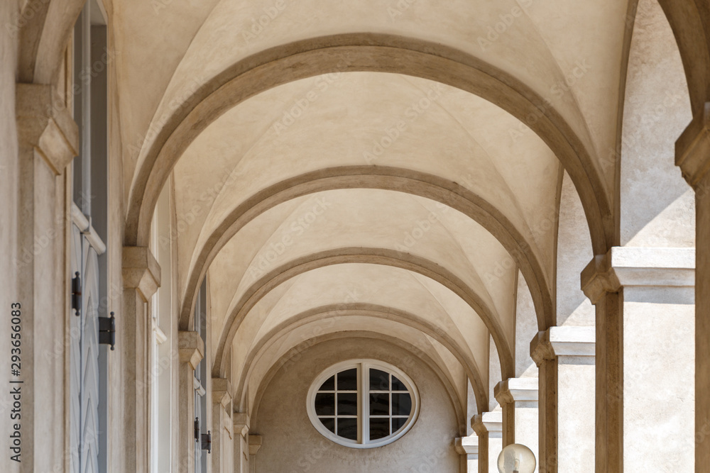 Oval double window with grids at the end of an arcade - arched ...