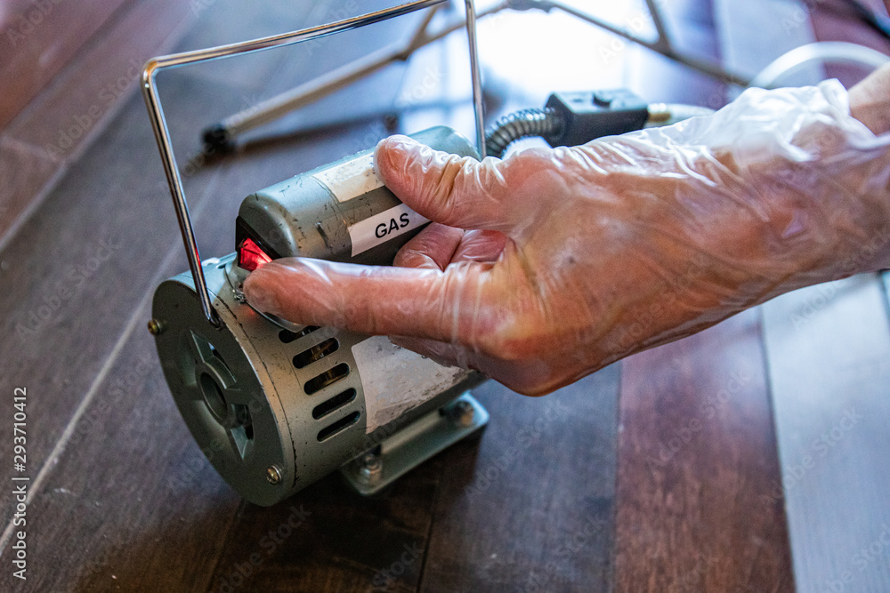 Indoor damp & air quality (IAQ) testing. A closeup view of a man ...