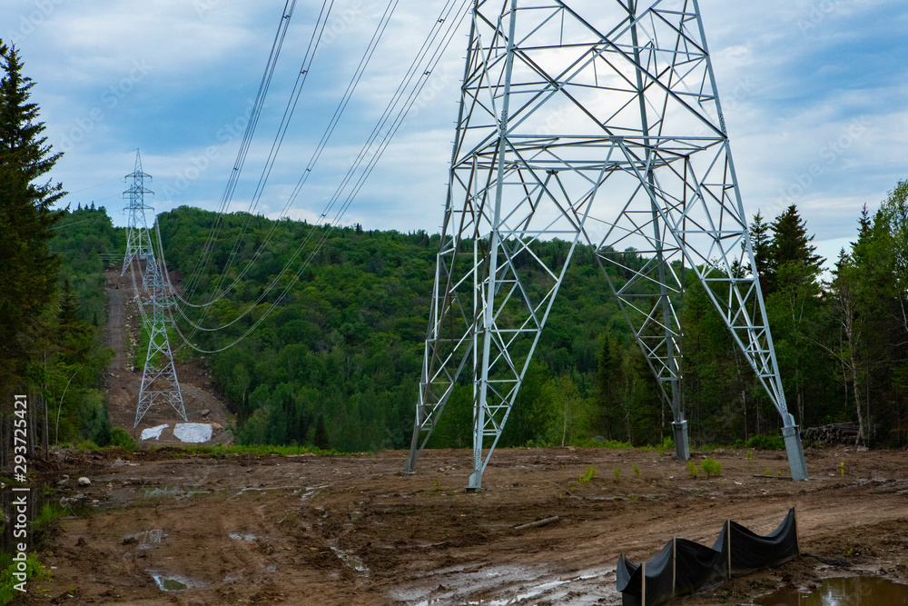 Electricity pylons in natural landscape. A large missing strip of ...