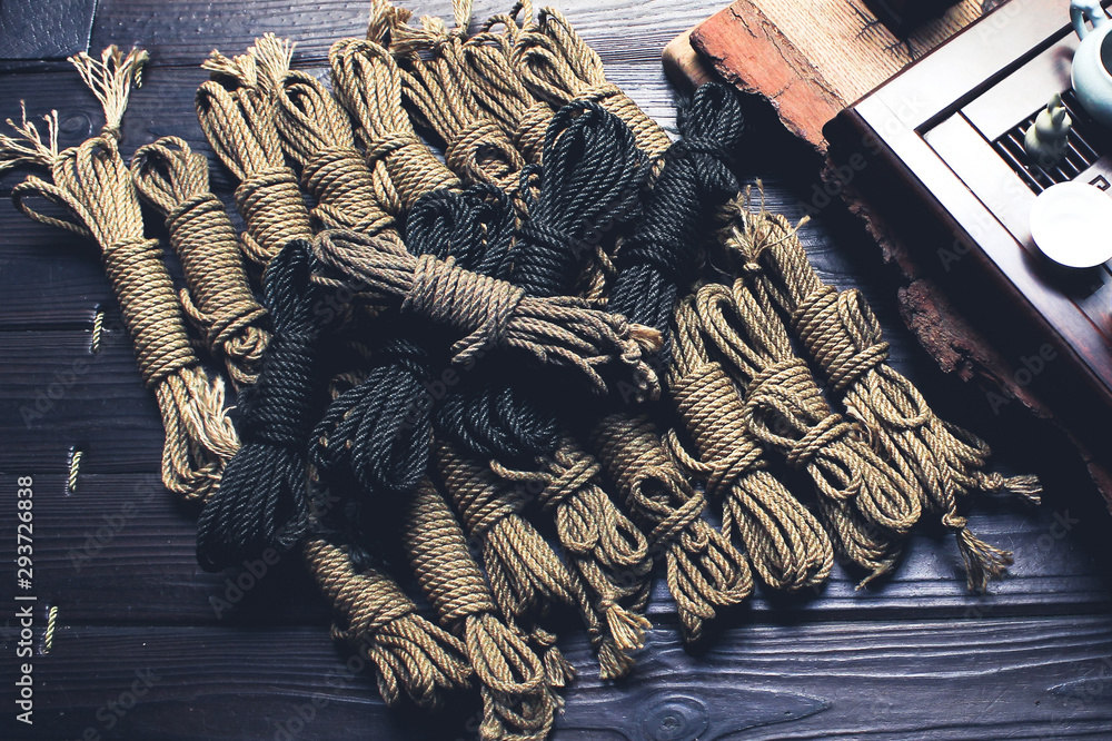 Ropes of ropes in different colors for a shibari with a tea set ...