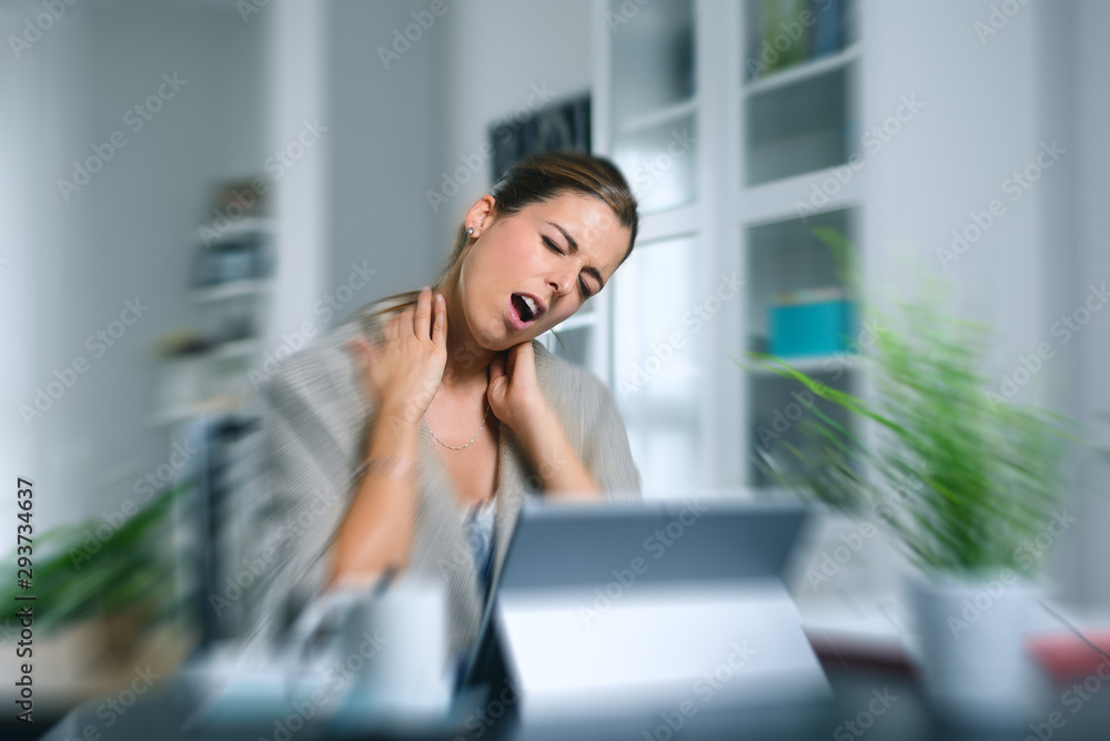 Dizzy young woman suffering neck cervical pain while working on her ...