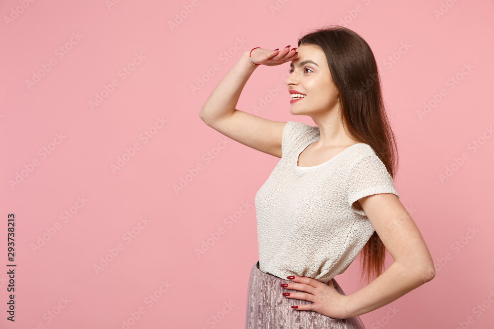 Side view of young woman in casual light clothes posing isolated on ...