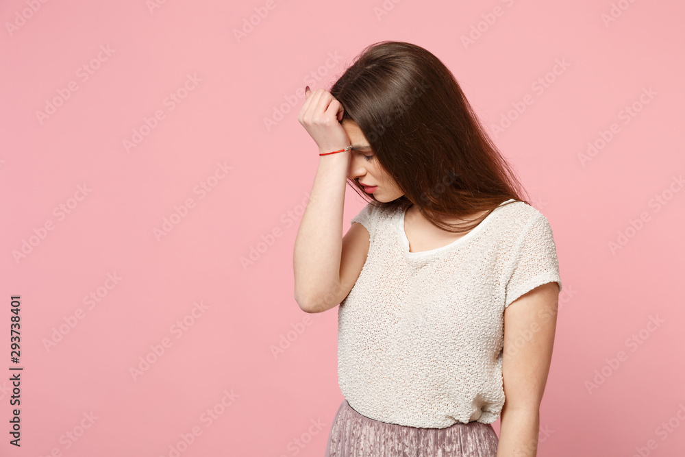 Exhausted young woman in casual light clothes posing isolated on pink ...