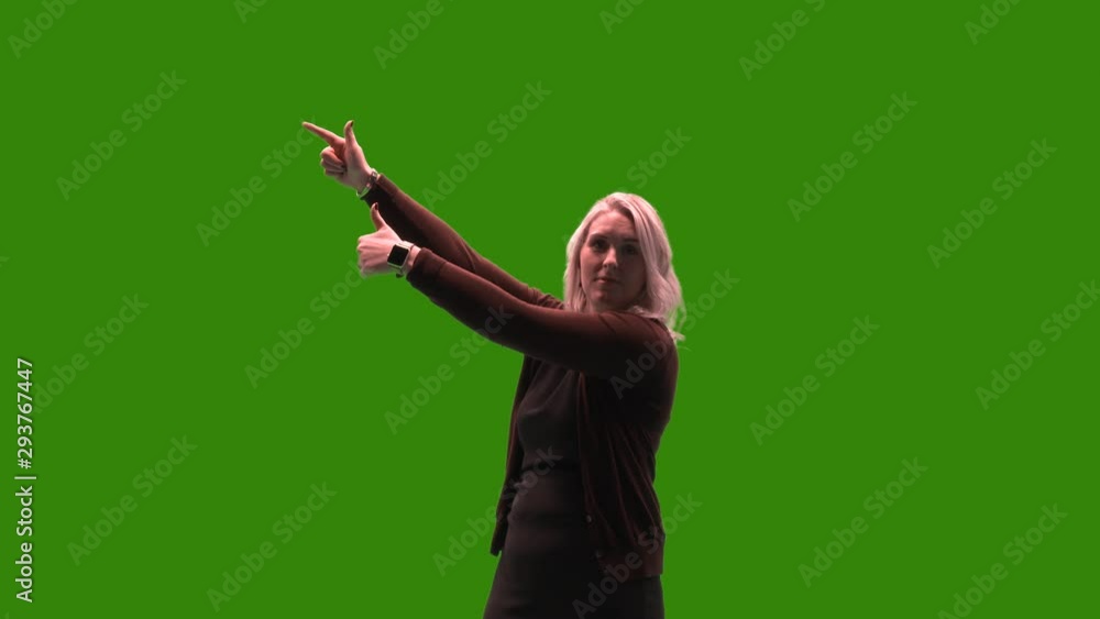 Female model on green screen pointing to the left up to approve ...