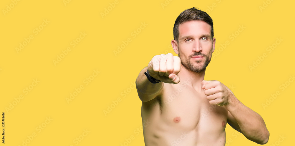 Handsome shirtless man showing nude chest Punching fist to fight ...