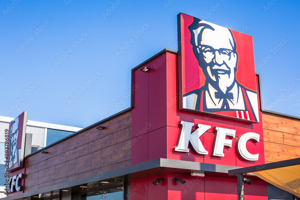 KFC fast food restaurant logo at its building Stock Photo | Adobe Stock