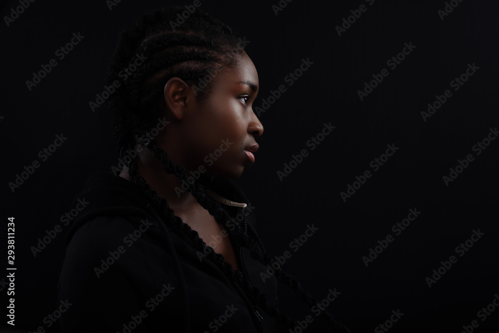 Cool and Real Black Female Model Looking Away Against Black Background ...
