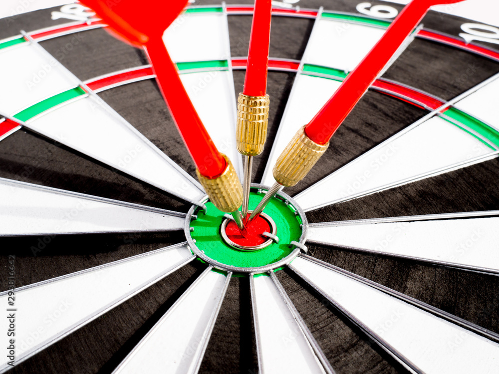 Target with three red dart focus on bull's eye, Setting challenging ...