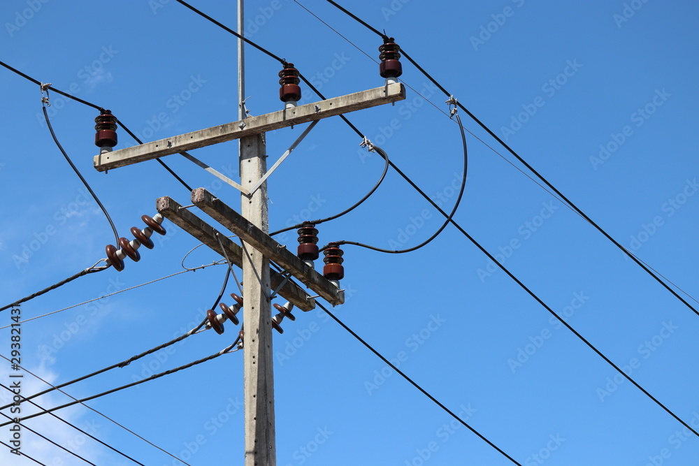 Power line post with electrical wires and capacitors isolated on blue ...