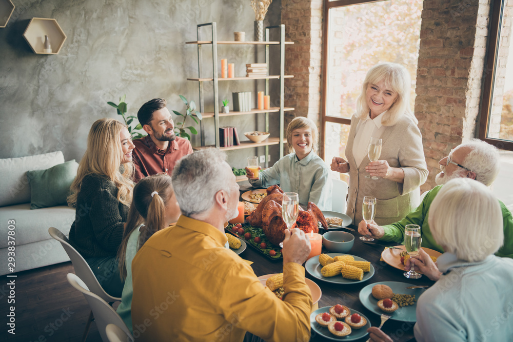 Portrait of nice cheerful big full family brother sister eating ...