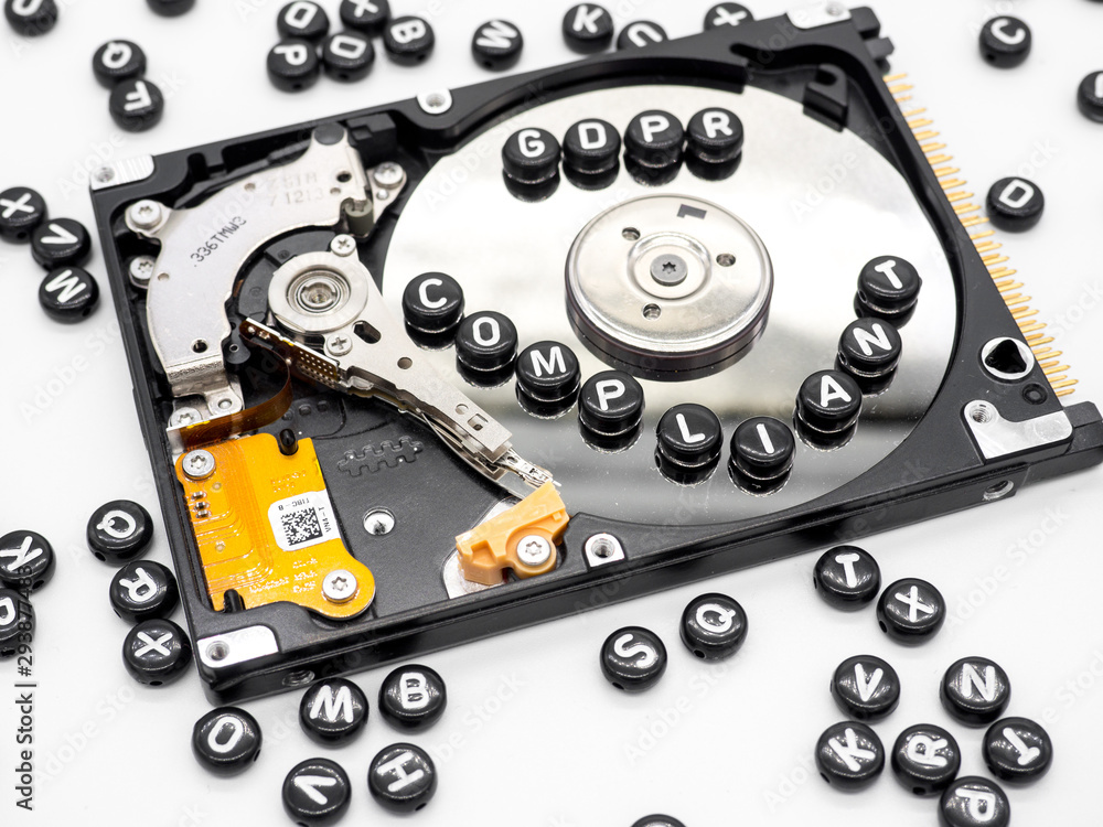 Dissembled hard disk drive and spread letters and gdpr compliant text ...
