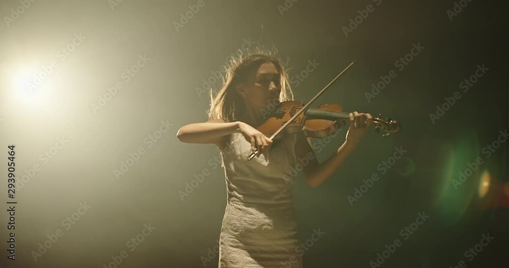 Professional female violin player performing an amazing solo during ...