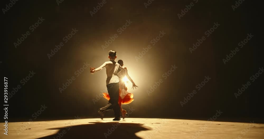 Talented asian kids showing ballroom dance on stage, on smoked black ...