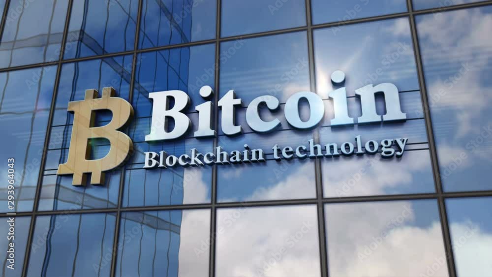 Bitcoin Blockchain technology on glass building. Mirrored sky and city ...