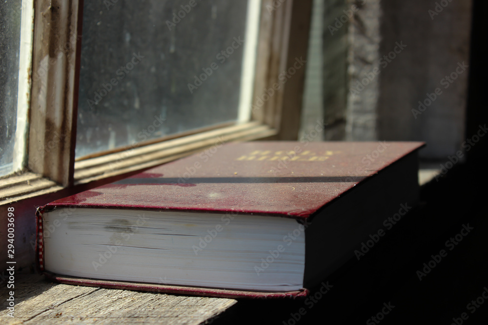 Dusty bible old book on table Stock Photo | Adobe Stock