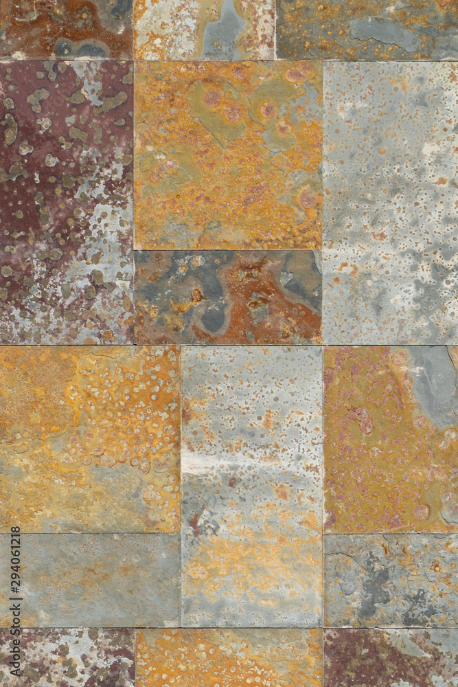 Destroyed by rust wall tiles with delamination and pores. Smooth ...