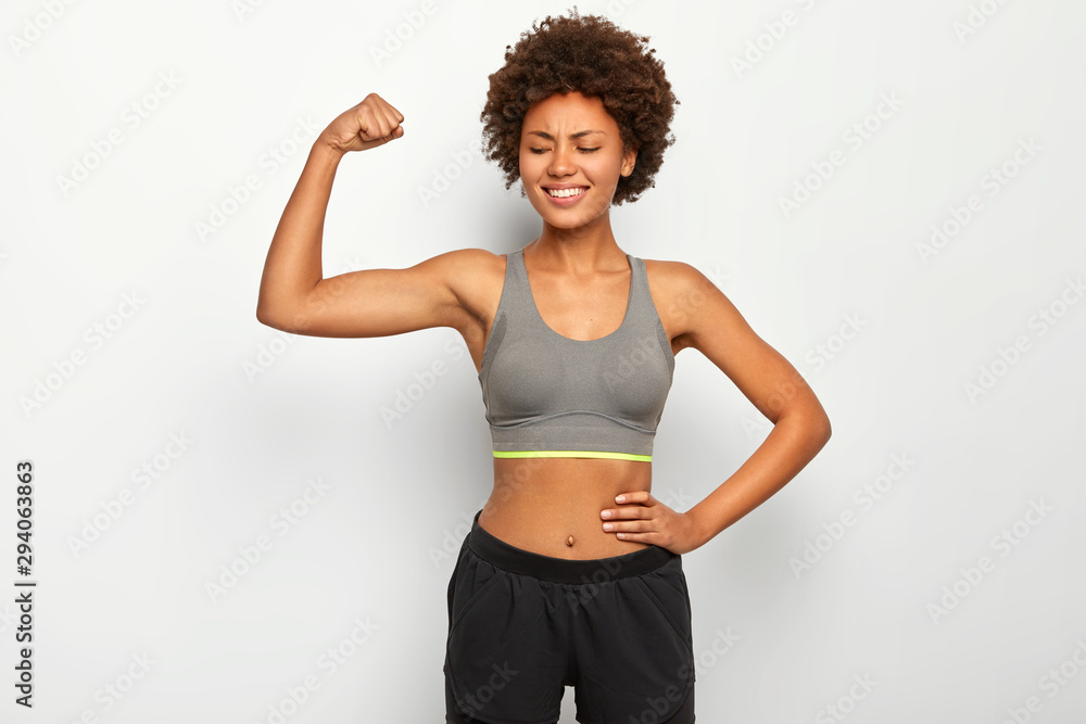 People Sport And Strength Concept Glad Curly Haired African American