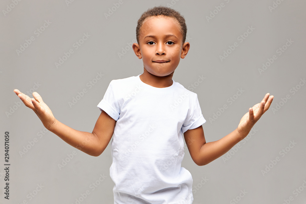 Children, lifestyle and body language. Isolated shot of cool handsome ...