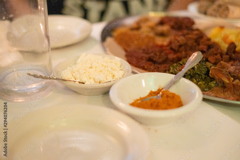 Foto de Ethiopian food on top of fermented injera bread do Stock ...