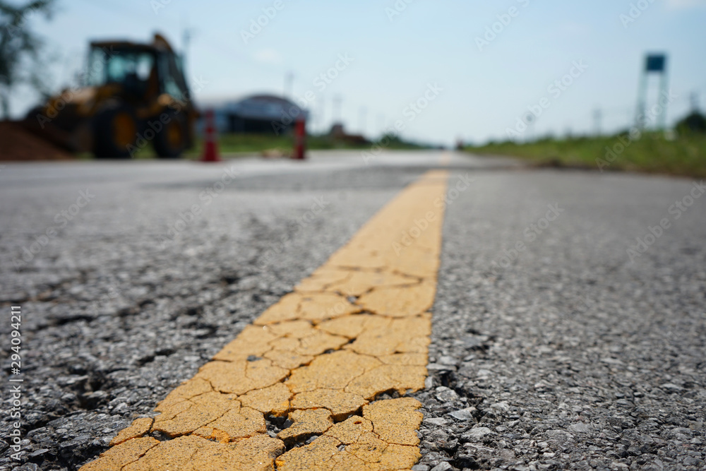 The road surface is broken into longitudinal lines on the yellow ...