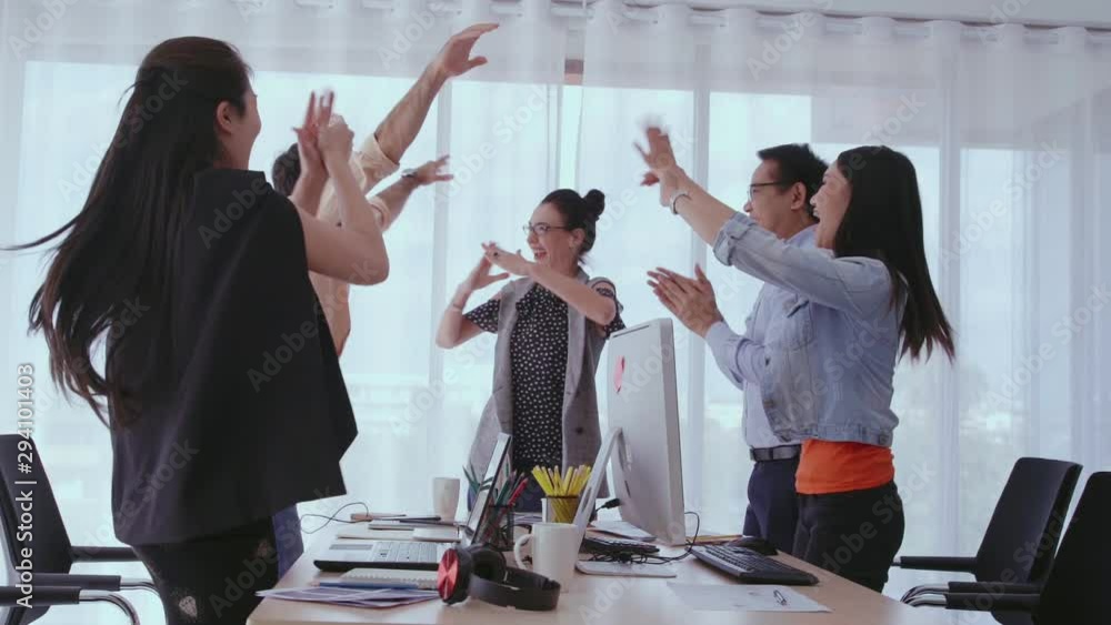 Successful business people group celebrating project success at office ...