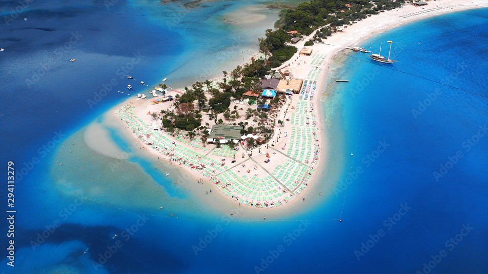 Blue lagoon beach in aegean sea near the village Oludeniz, Turkey. It ...