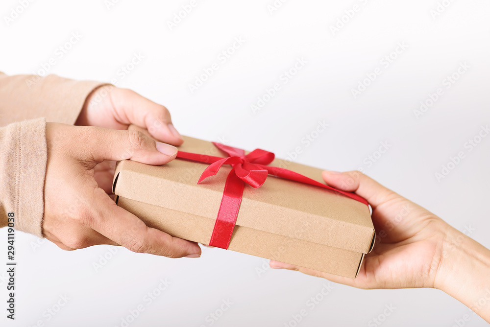 Hands holding gift box for giving together in special day Stock Photo ...