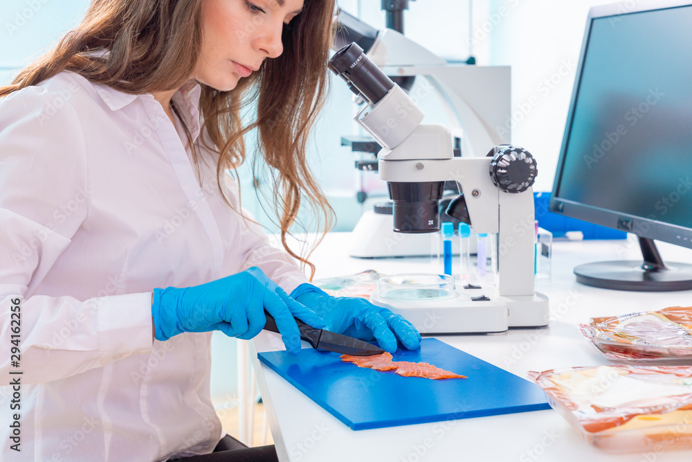 Young woman in food quality control lab Stock Photo | Adobe Stock