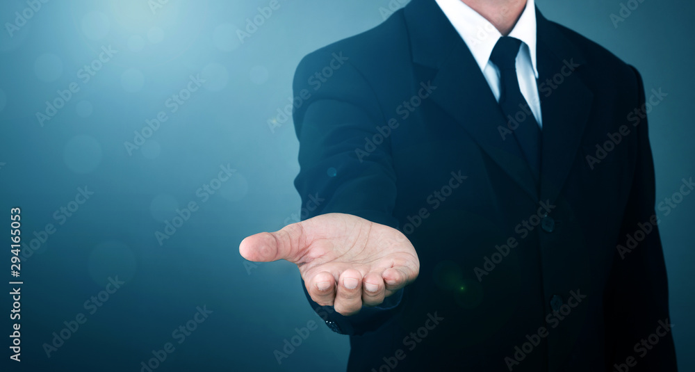 Asian Man standing and shows outstretched hand with open palm on Light ...
