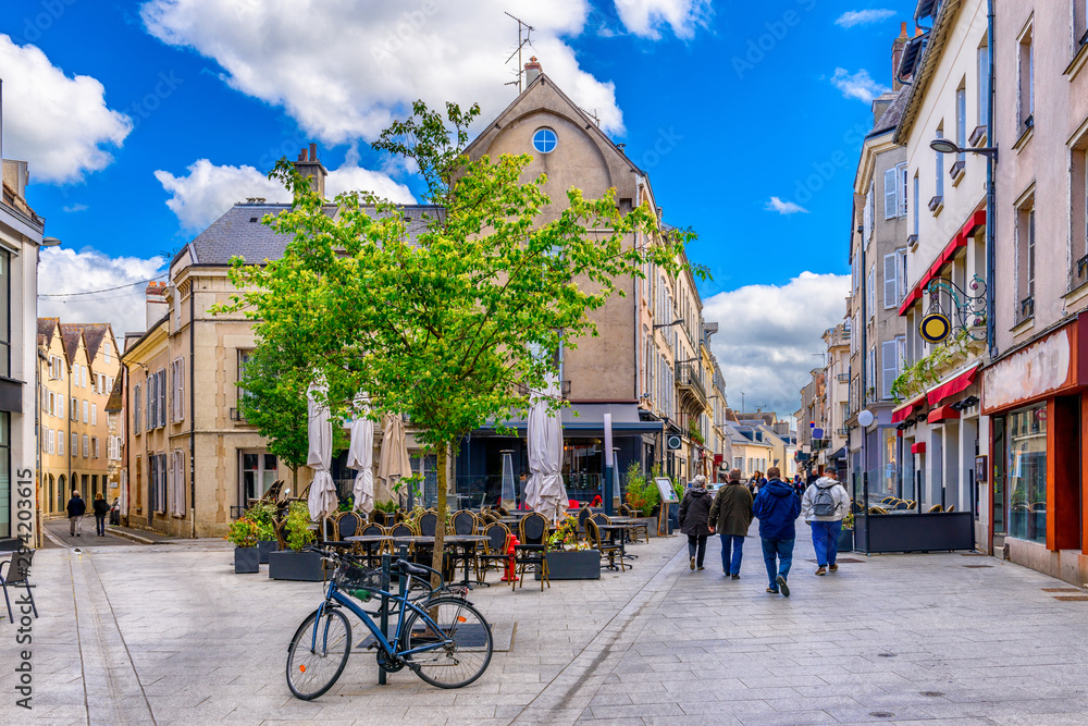 Photo & Art Print Old street with old houses and tables of cafe in a ...