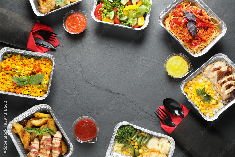 Frame made of lunchboxes on grey table, flat lay with space for text ...