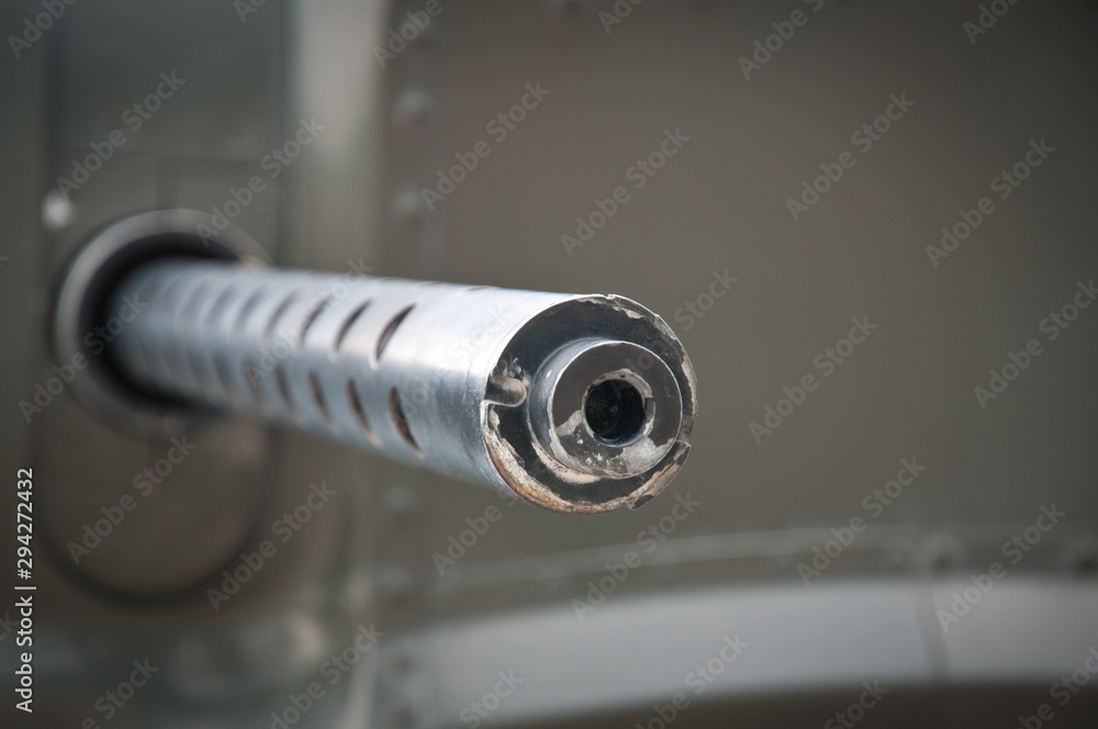 .50 (fifty) caliber air cooled machine gun barrel protruding from ...