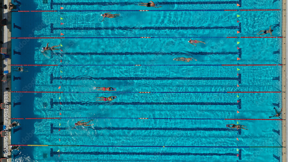 Aerial top view photo of people swimming and practising in outdoor pool ...