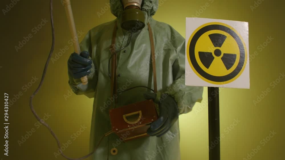 The concept of environmental disaster and radiation pollution. A man in ...