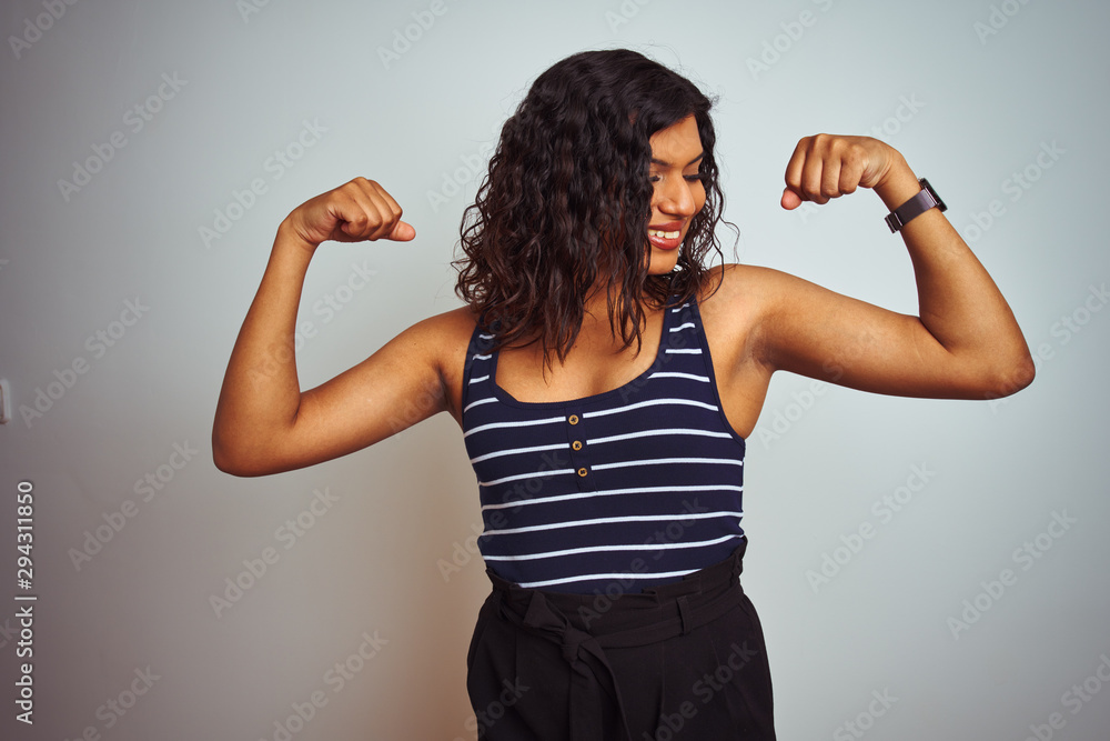 Transsexual transgender woman wearing striped t-shirt over isolated ...