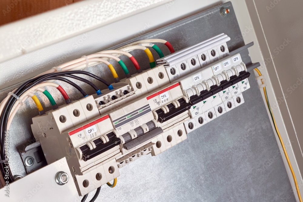 Foto de A series of modular circuit breakers in an electrical Cabinet ...