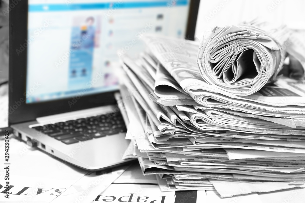 Newspapers and Laptop. Different Concepts for News - Network or ...