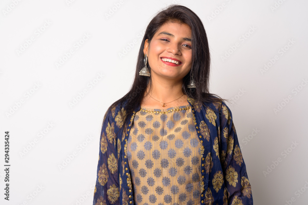 Face of happy young Persian woman smiling in traditional clothing Stock ...