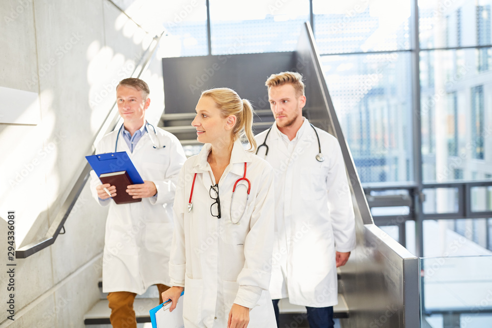 Young female doctor or assistant doctor with colleagues Stock Photo ...