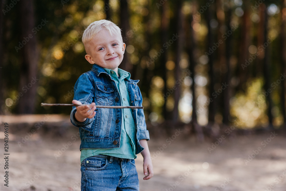 Emotional portrait of a happy and cheerful little boy, running after a ...