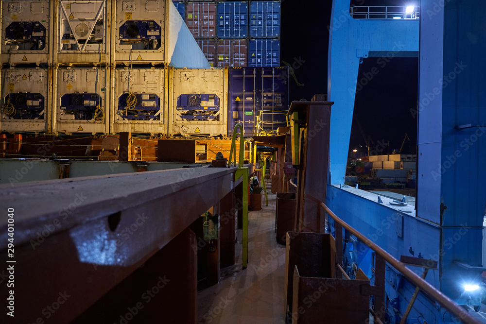 Containers stack on ship deck. Container loading in Cargo freight ship ...