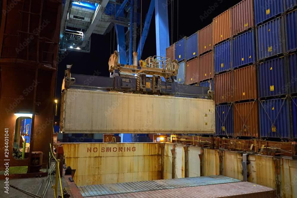 Containers stack on ship deck. Container loading in Cargo freight ship ...