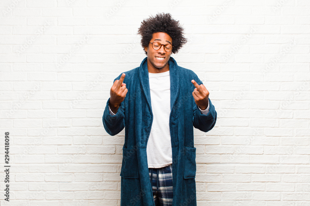 young black man wearing pajamas with gown feeling provocative ...
