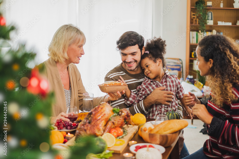 Happy Thanksgiving dinner party with family and food with turkey on ...