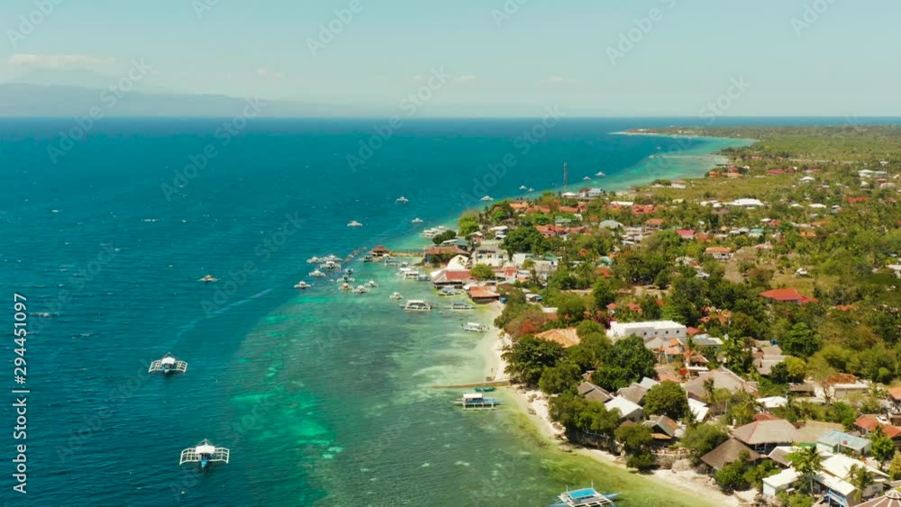 Coast of Cebu island, Moalboal, Philippines, top view. Philippine boats ...